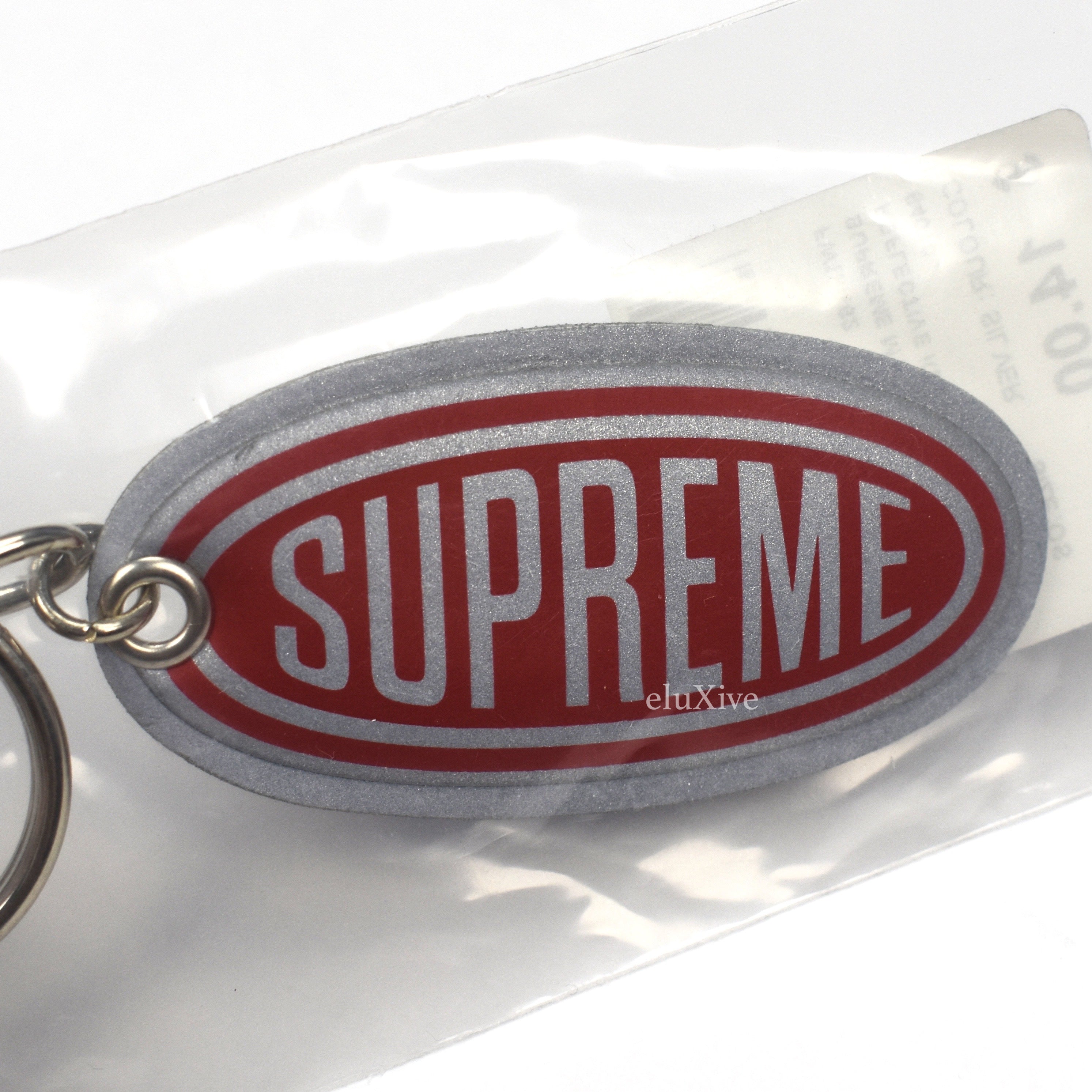 Supreme - Reflective Oval Logo Keychain – eluXive